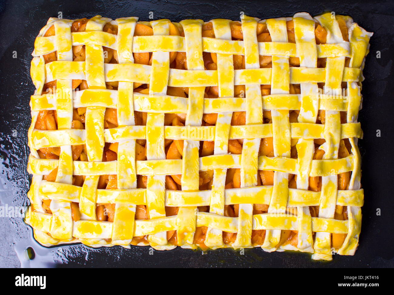 Unbaked homemade fruit sweet pie on a baking pan Stock Photo - Alamy