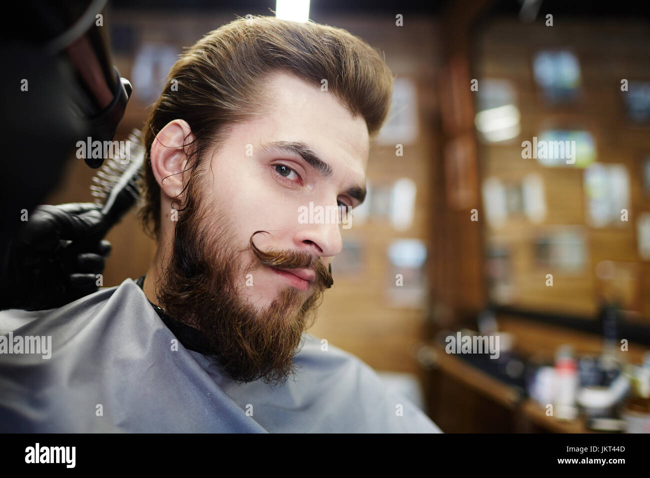 Neat man with beard and moustache looking at camera Stock Photo - Alamy