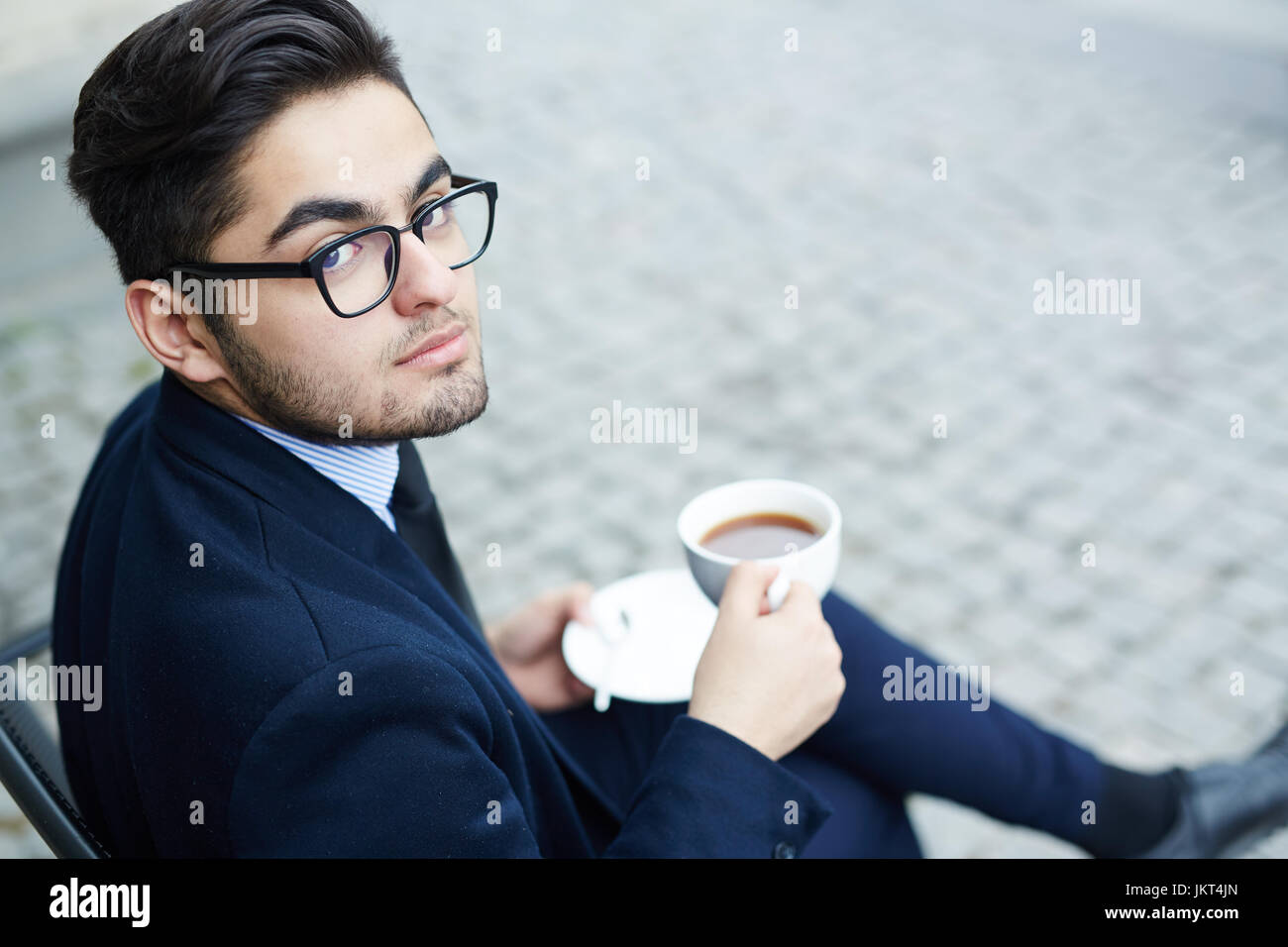 Posh man in suit having tea outdoors Stock Photo - Alamy