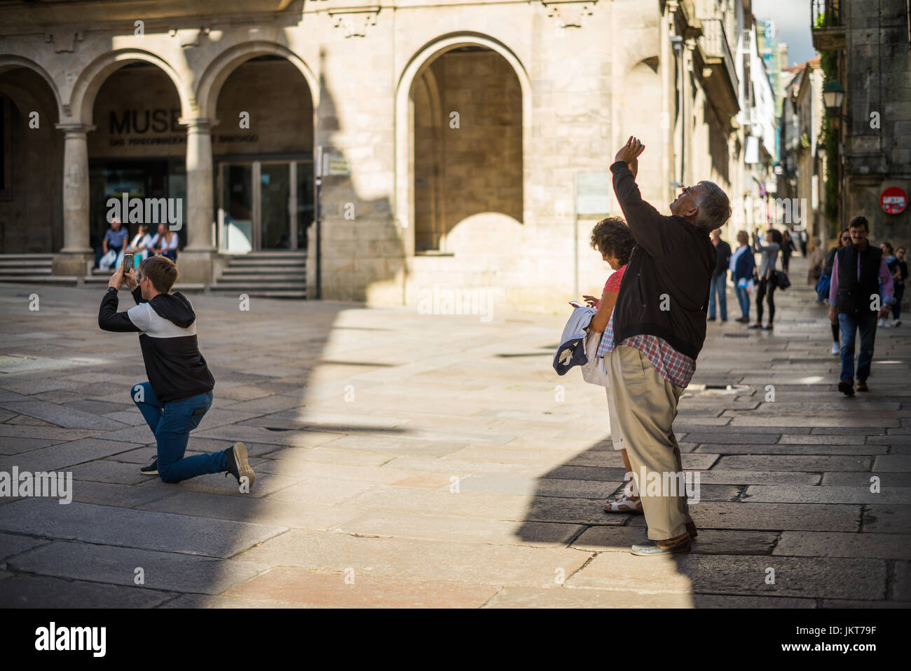 Local people, tourists or pilgrims in the street of the Santiago de ...