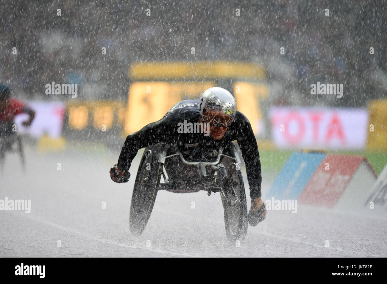 Marcel Hug wheelchair athlete competing in wet 5000m T54 final at the ...