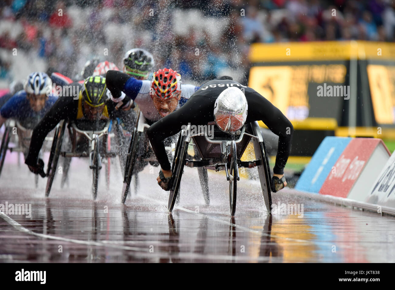 Marcel Hug wheelchair athlete competing in wet 5000m T54 final at the ...