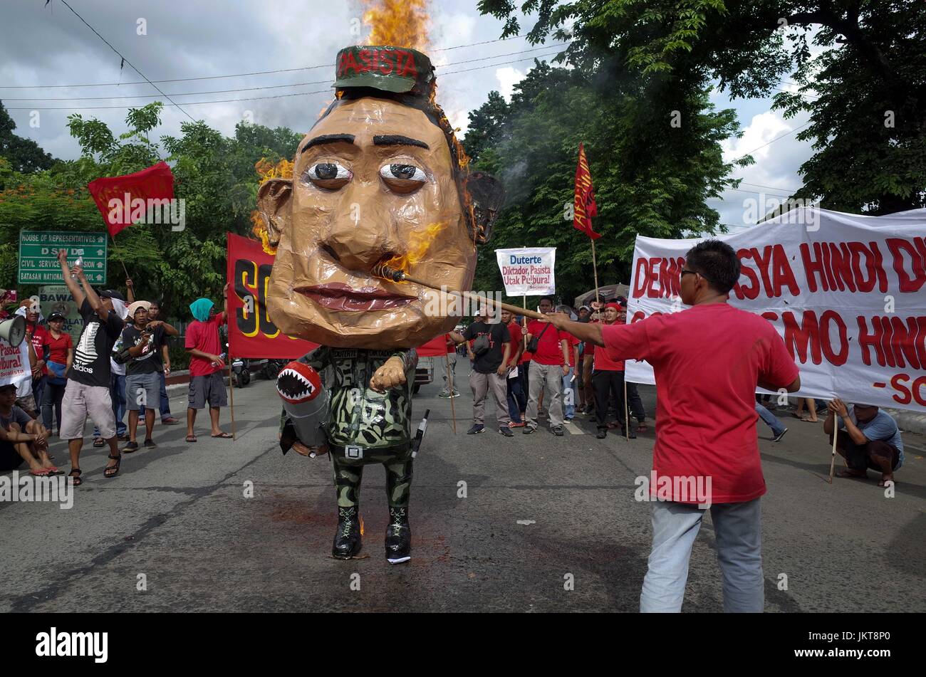 Philippines. 24th July, 2017. A protester sets ablaze an effigy of ...