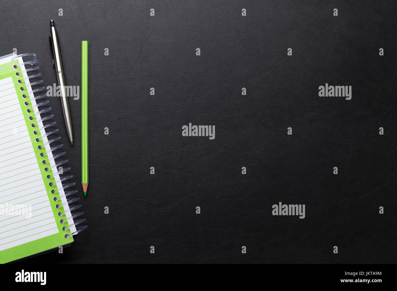 Office desk with notepad and supplies. Top view with space for your ...