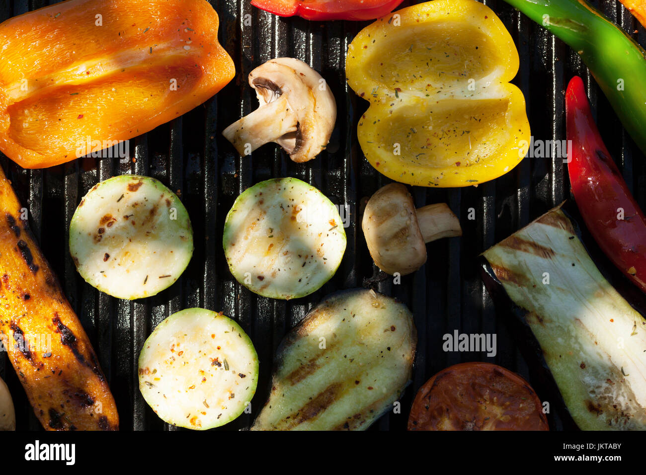Grilled vegetables cooking. Top view Stock Photo - Alamy