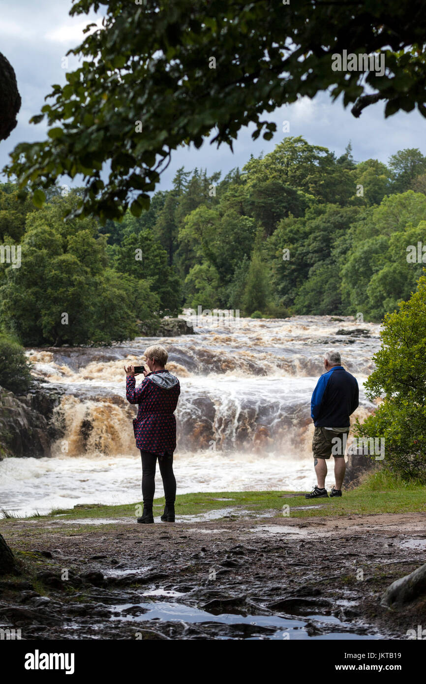 Two People Enjoying the Spectacle of the River Tees in Flood at Low ...