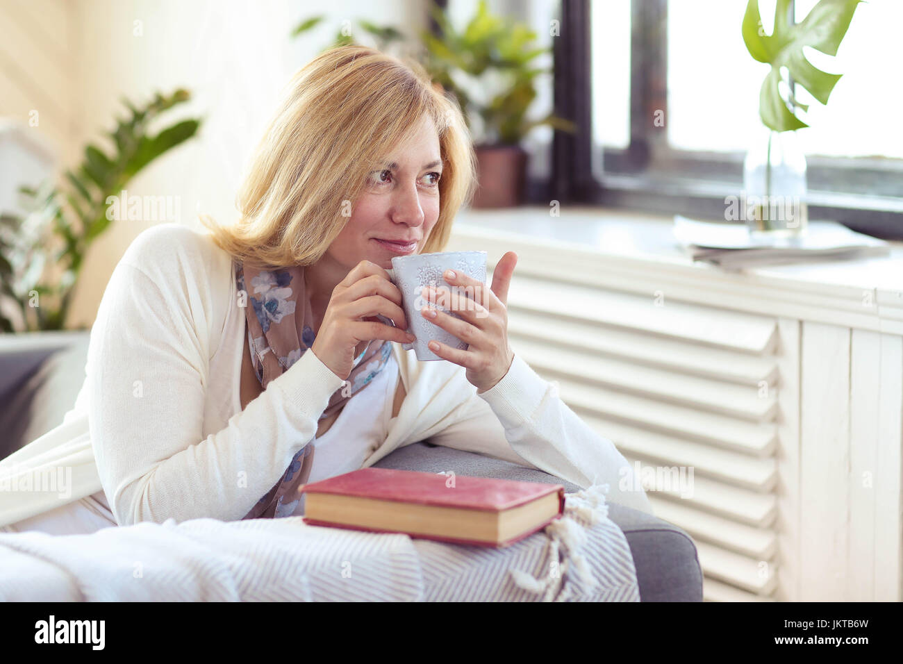 Woman at home Stock Photo - Alamy