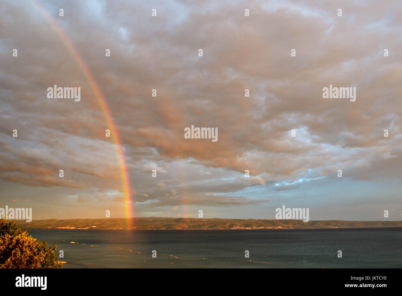 Beautiful rainbow over the sea Stock Photo - Alamy