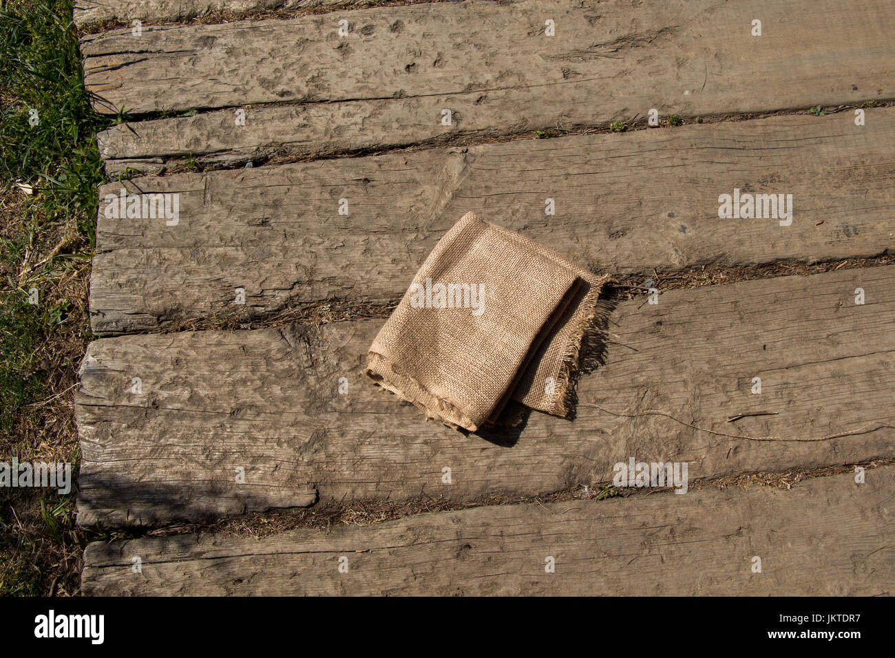 Brown color natural linen texture fabric on wood Stock Photo - Alamy