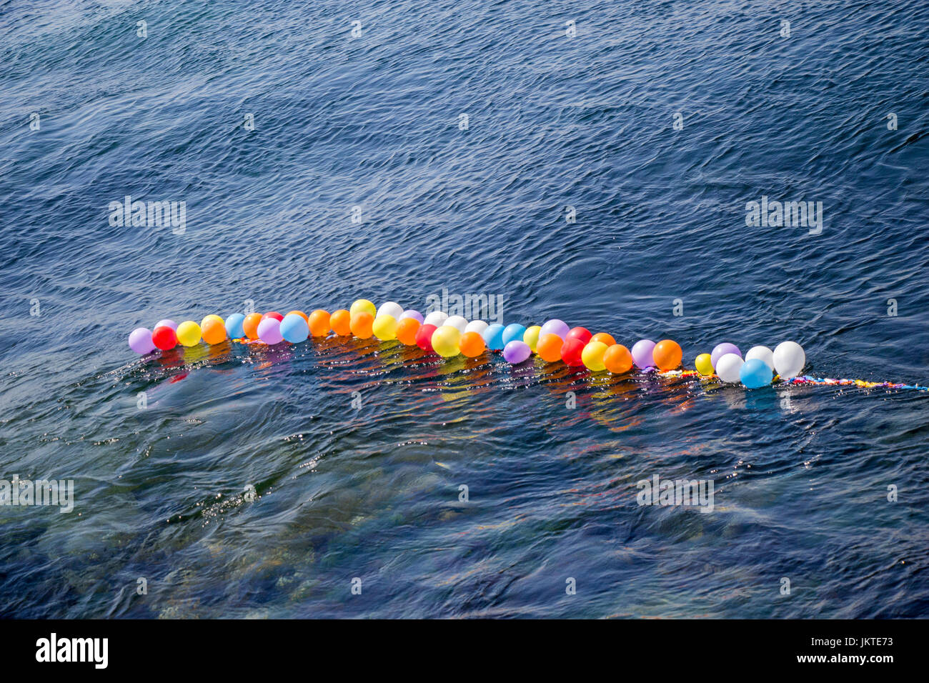 Balloons in shooting range as targets on water Stock Photo - Alamy