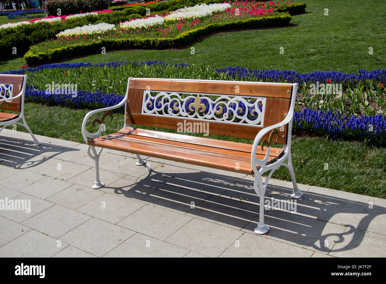 Wooden park bench at a park Stock Photo - Alamy