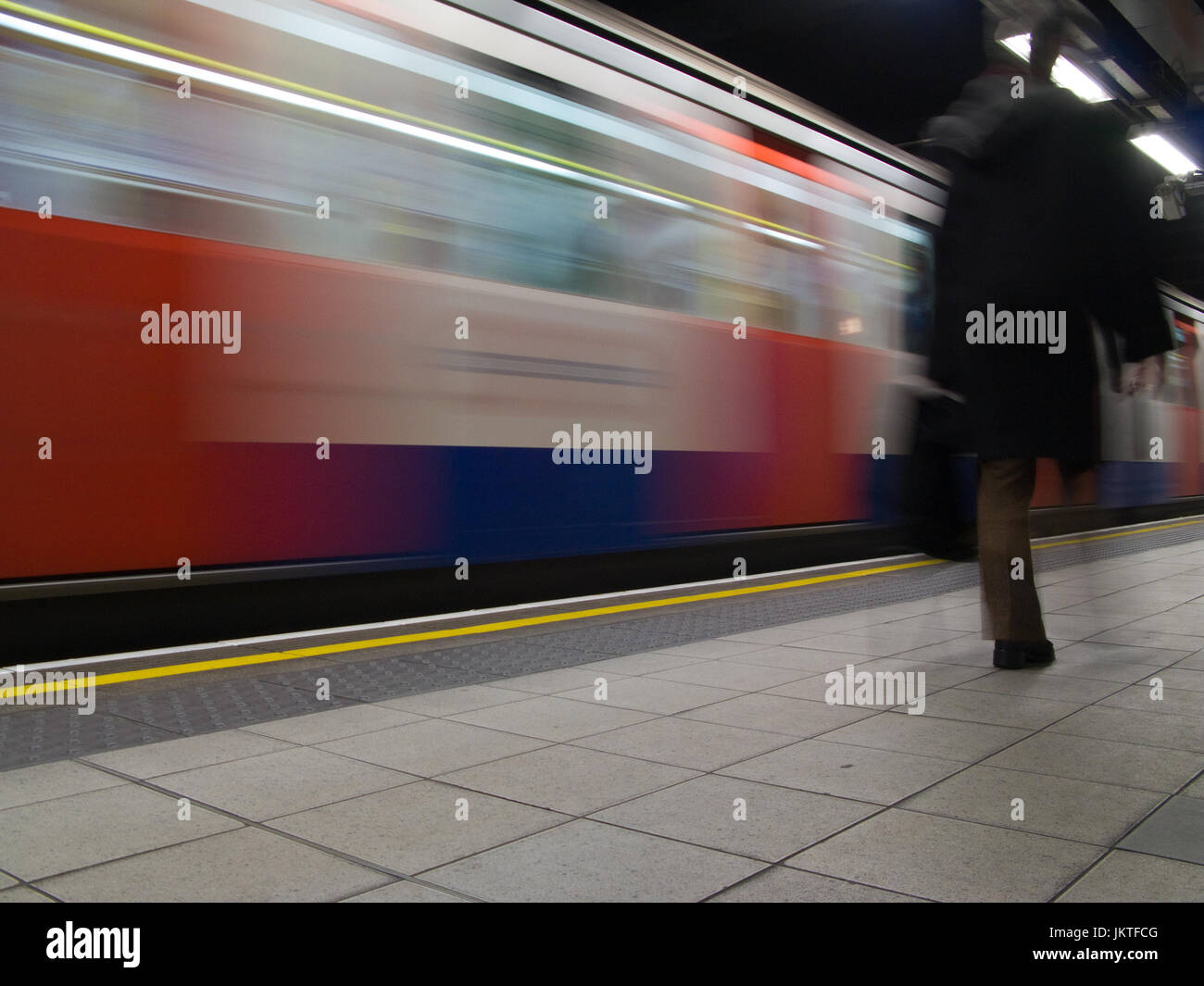 Tube train and commuter, abstract Stock Photo - Alamy