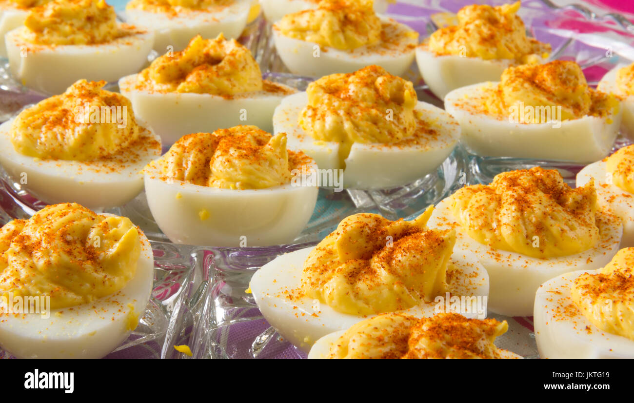 Several delicious Deviled Eggs topped with paprika Stock Photo - Alamy
