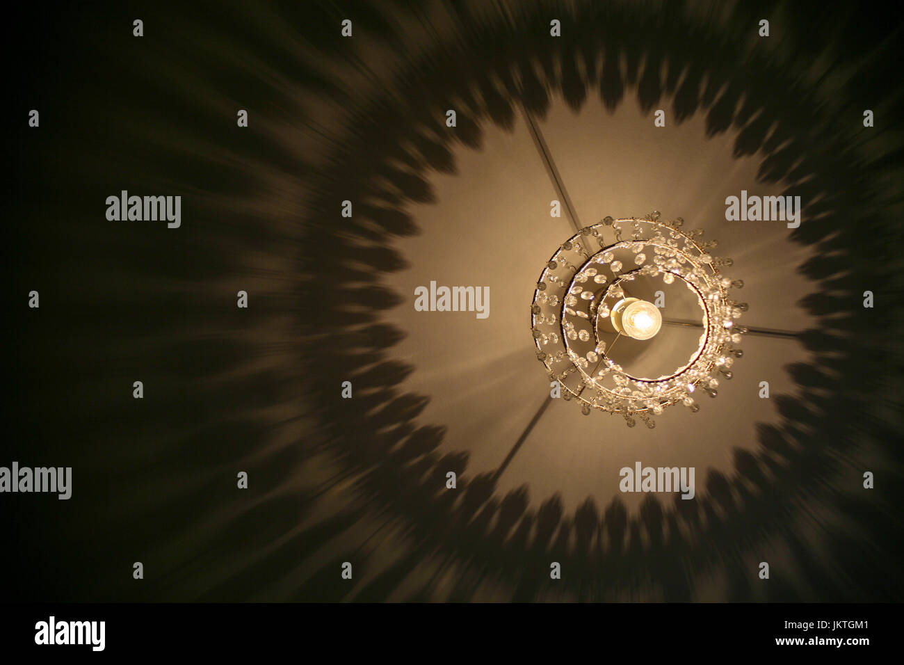 Pattern of shadow cast by chandelier on ceiling hi-res stock ...