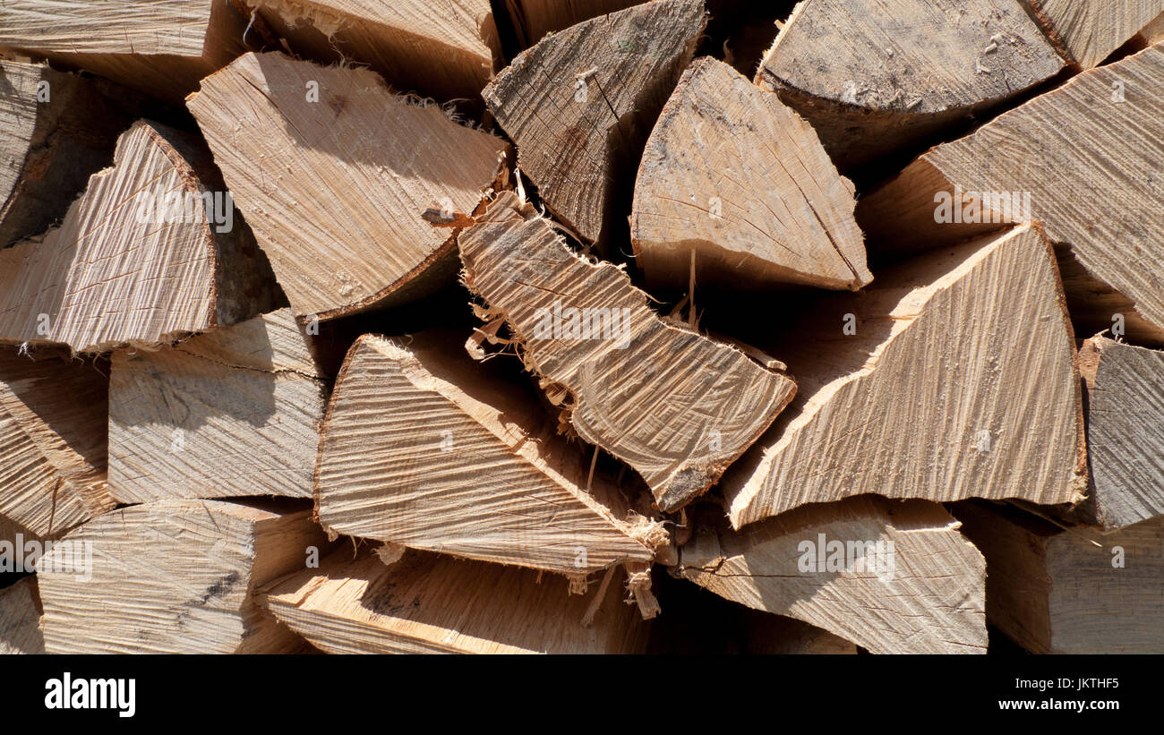Cut logs, stacked Stock Photo - Alamy