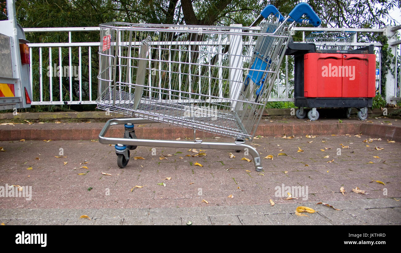 Shopping Trolley with a Wheel Off Stock Photo - Alamy