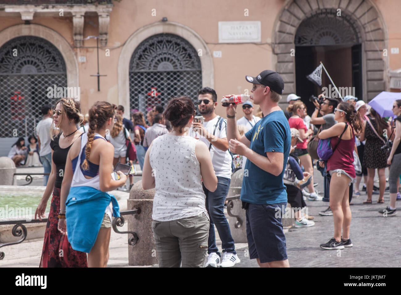 Crowded group of tourists during the summer season in rome Stock Photo ...