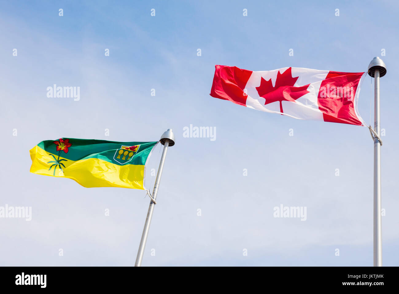 Saskatchewan and Canada flags against blue sky. Regina, Saskatchewan ...