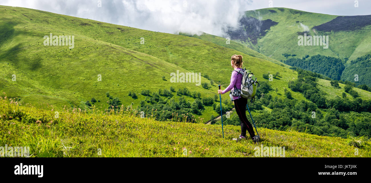 Young woman hiking in the mountains Stock Photo - Alamy