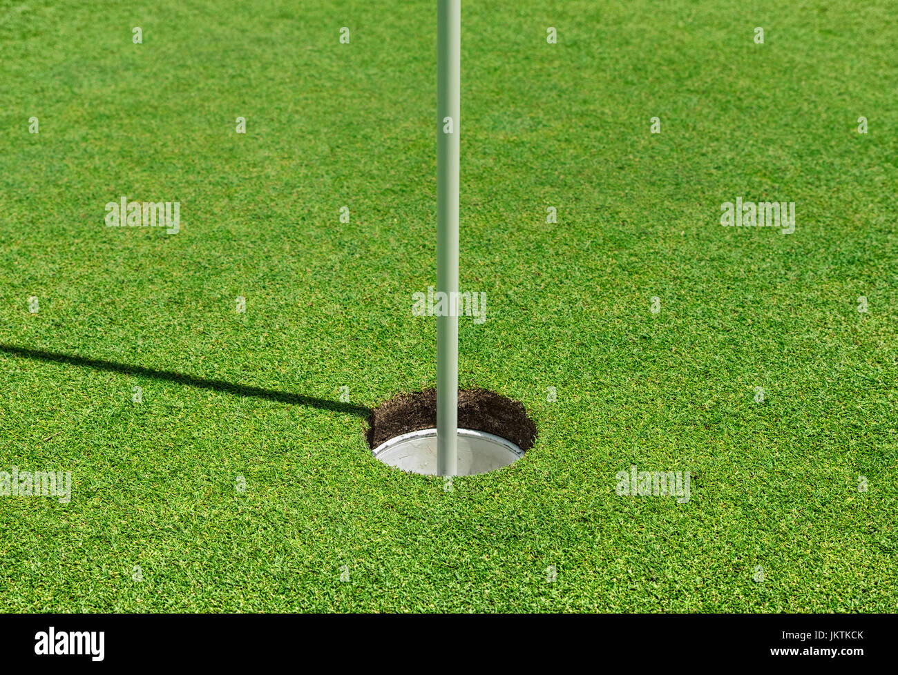 Golf hole on the putting green Stock Photo - Alamy