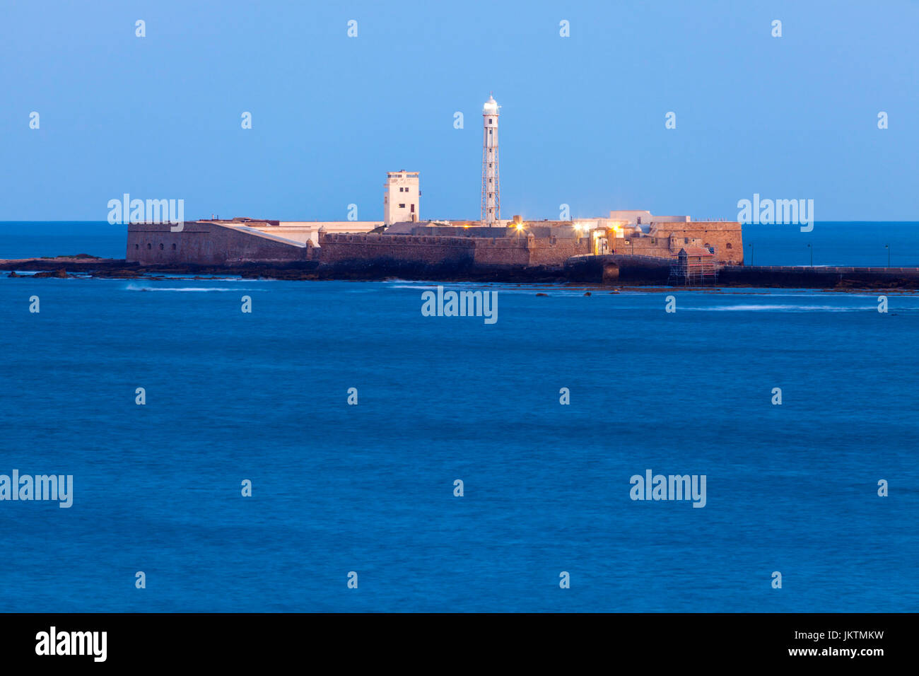 Panorama of Cadiz with the lighthouse seen at night. Cadiz, Andalusia ...