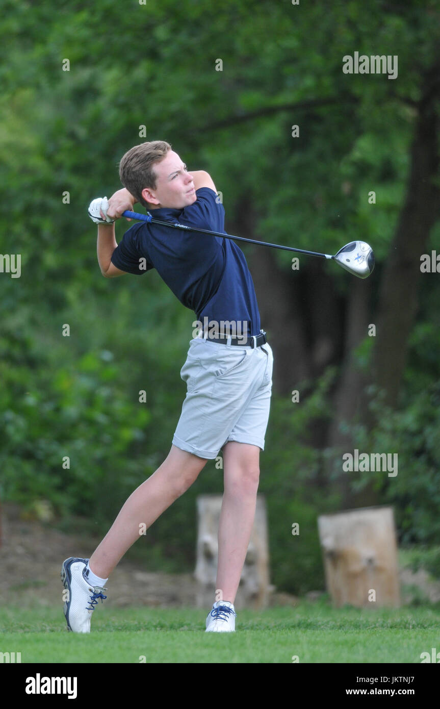Junior child teenager golfer playing golf Stock Photo - Alamy