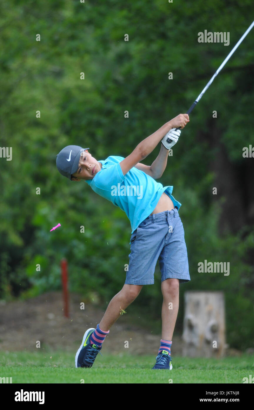 Junior child teenager golfer playing golf Stock Photo - Alamy