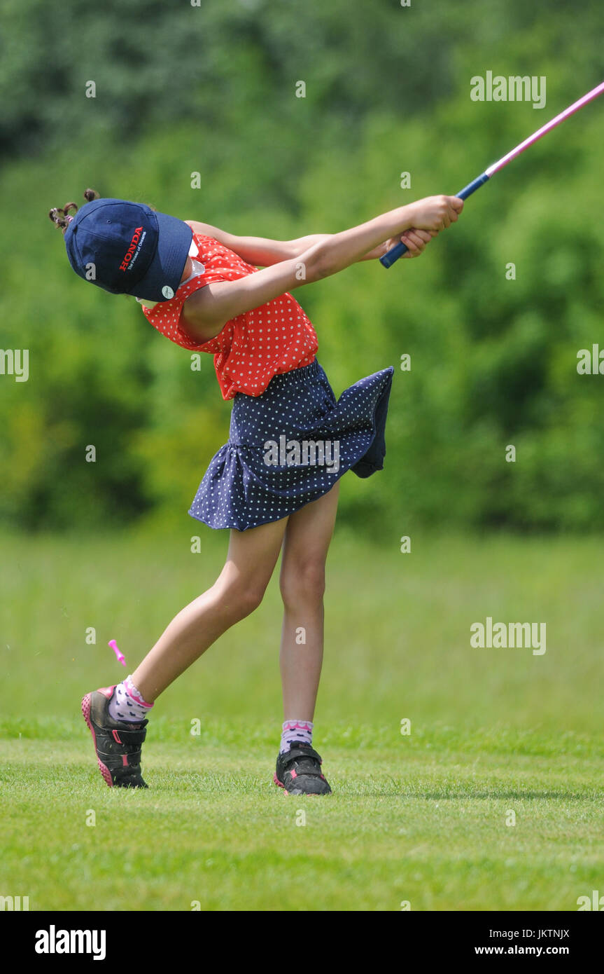 Junior child teenager golfer playing golf Stock Photo - Alamy