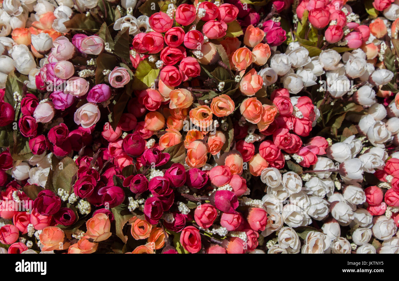 Colorful fake artificial flowers in view Stock Photo - Alamy
