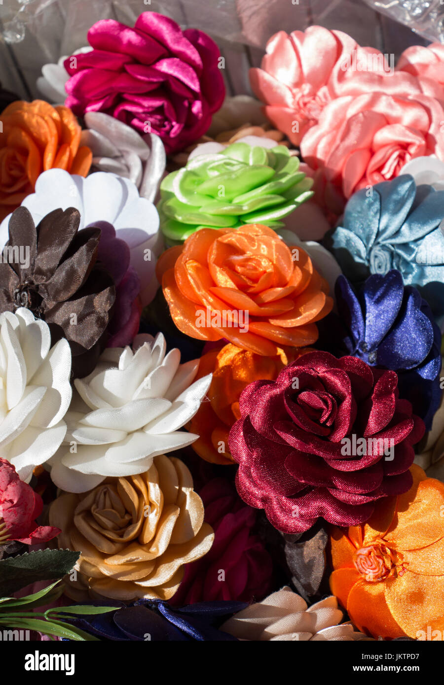 Colorful fake artificial flowers in view Stock Photo - Alamy