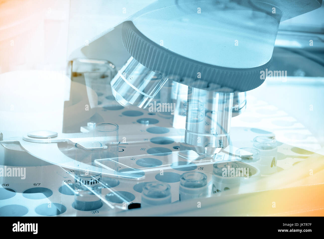 Serious clinician studying chemical element in laboratory Stock Photo ...