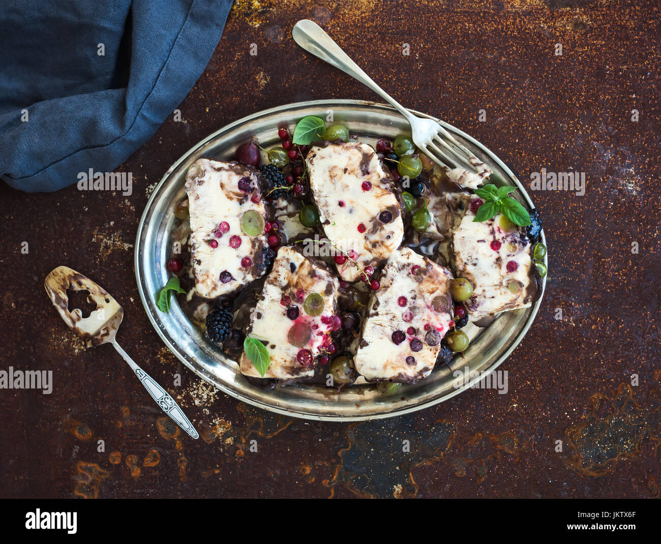 Semifreddo or italian cheese ice-cream dessert with garden berries and ...