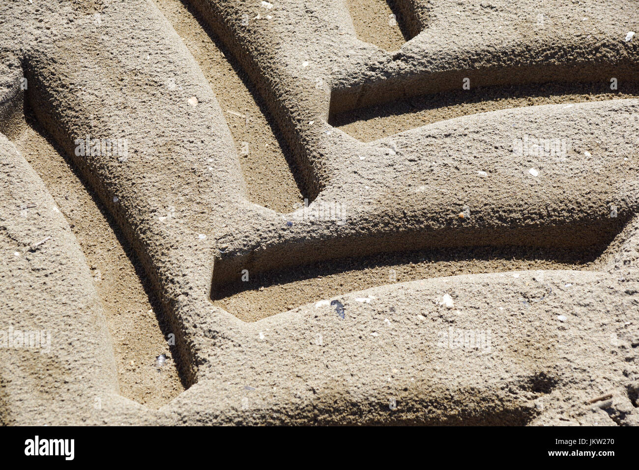 Tire tread footprints of a tractor on the sand Stock Photo - Alamy