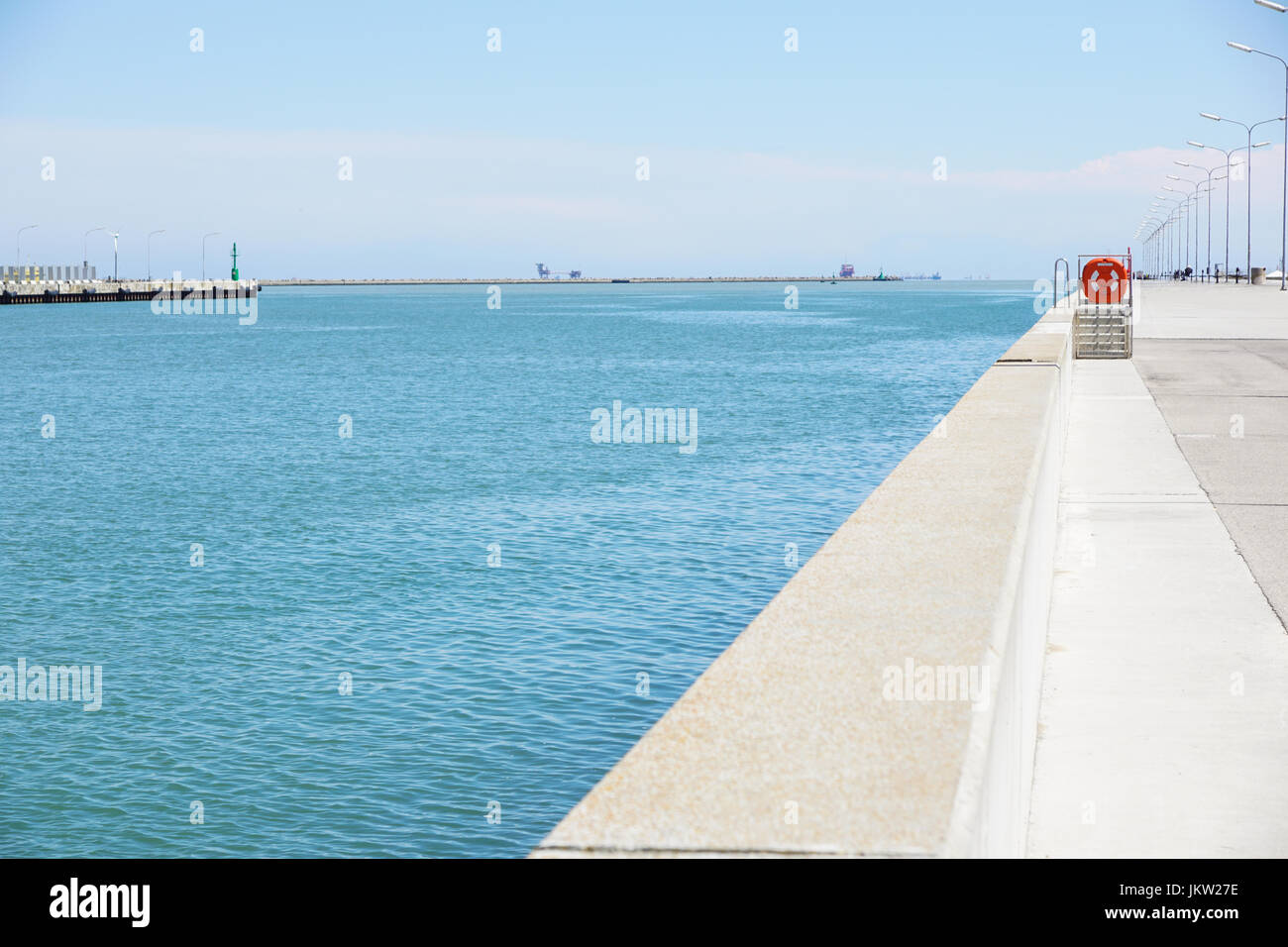 Concrete pier like quay with mooring sides Stock Photo - Alamy