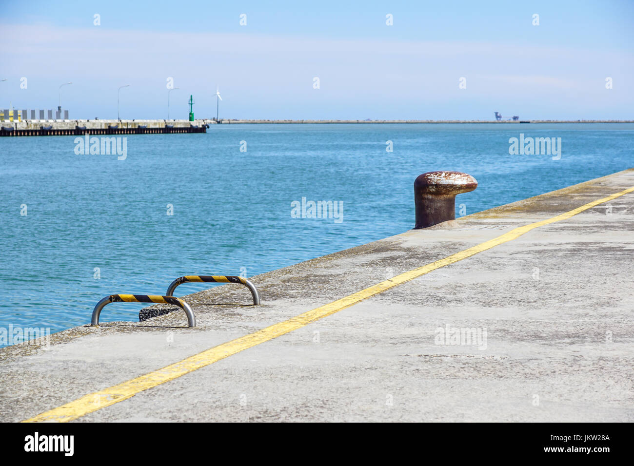 Concrete pier like quay with mooring sides Stock Photo - Alamy