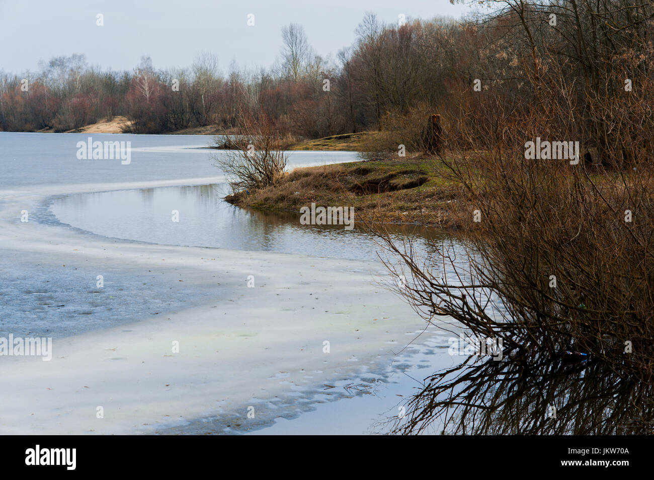 Nature background with spring landscape and melting ice at the lake ...