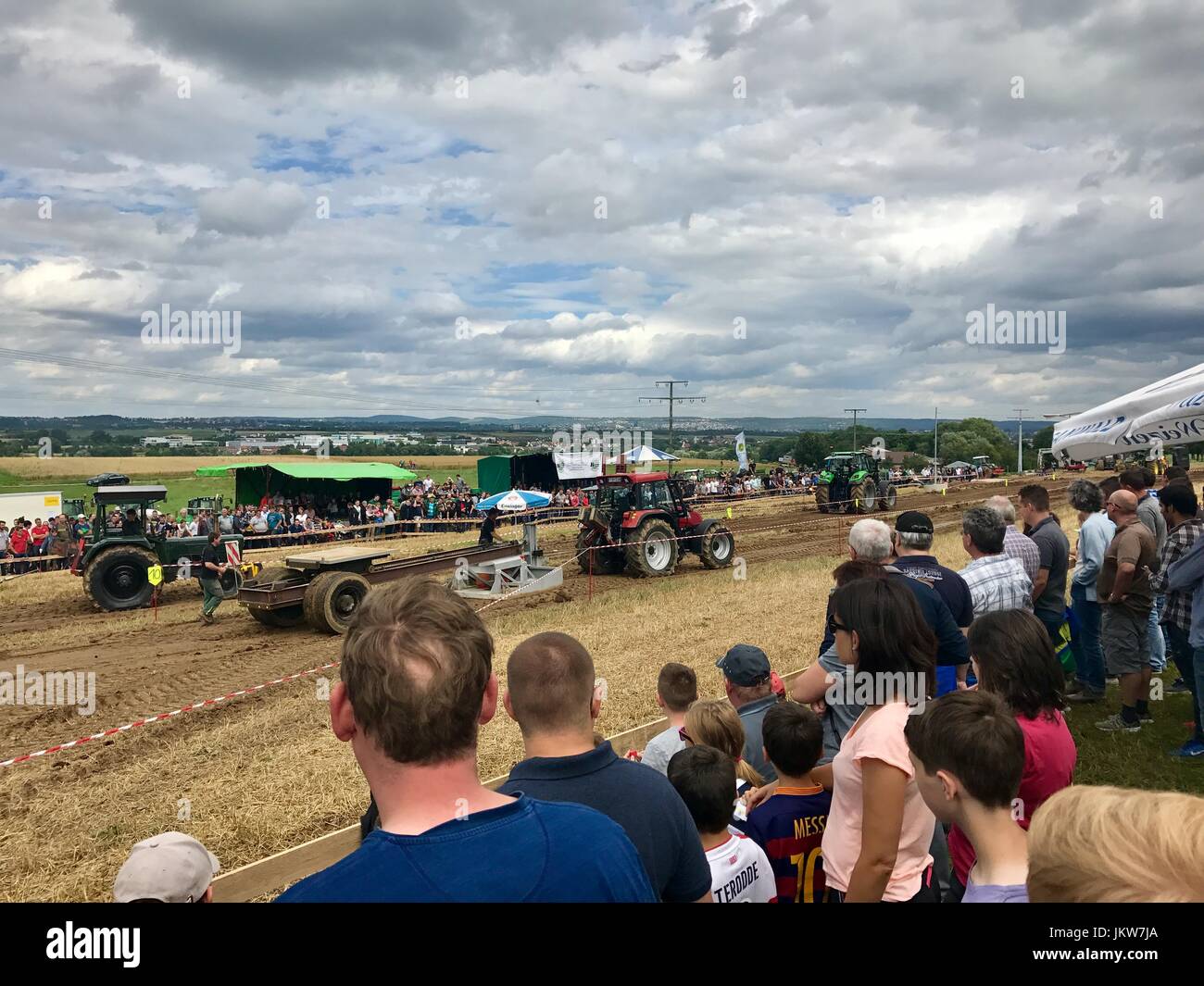 Tractor pulling heavy weight Stock Photo - Alamy