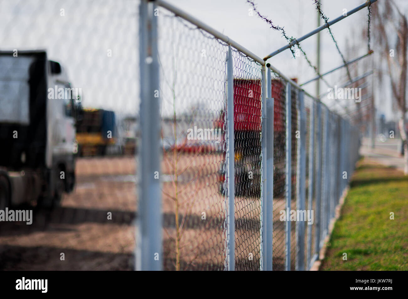 Security with a barbed wire fence Stock Photo - Alamy
