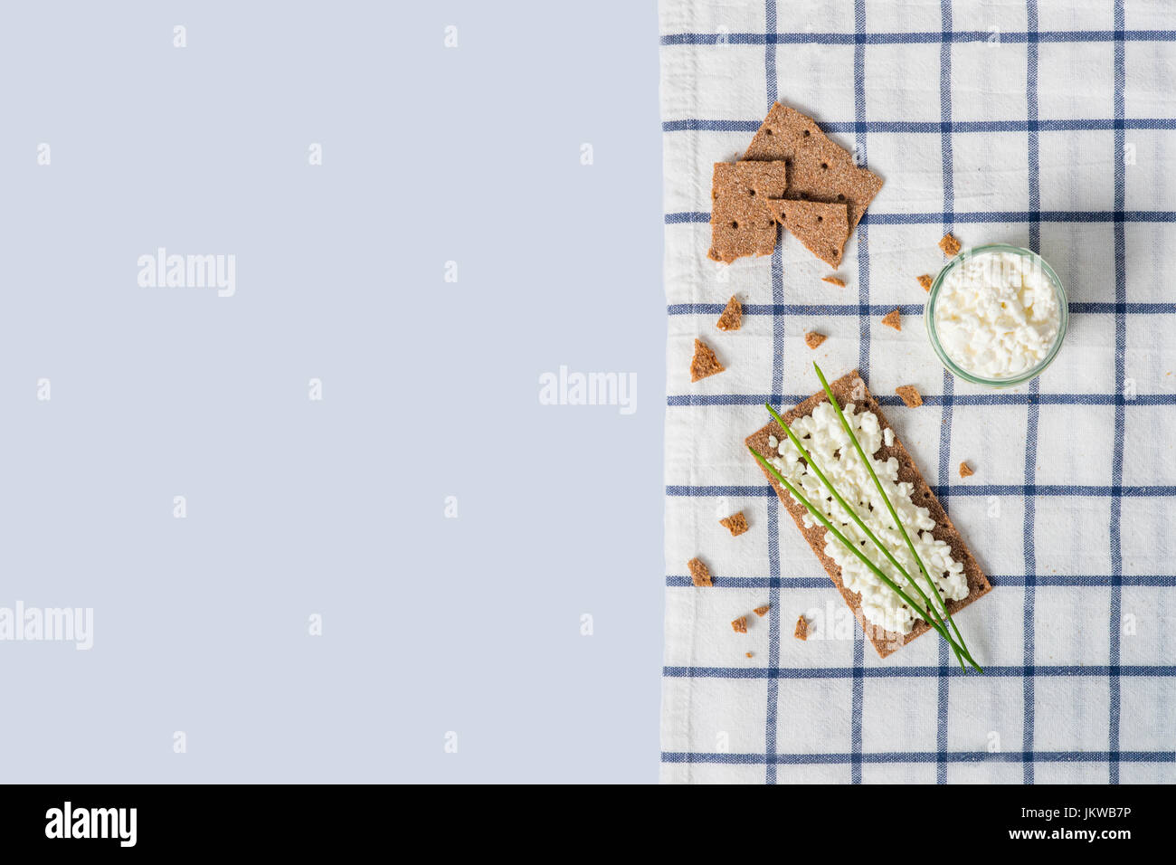 Brown rye crispy bread (Swedish crackers) with spread cottage cheese ...