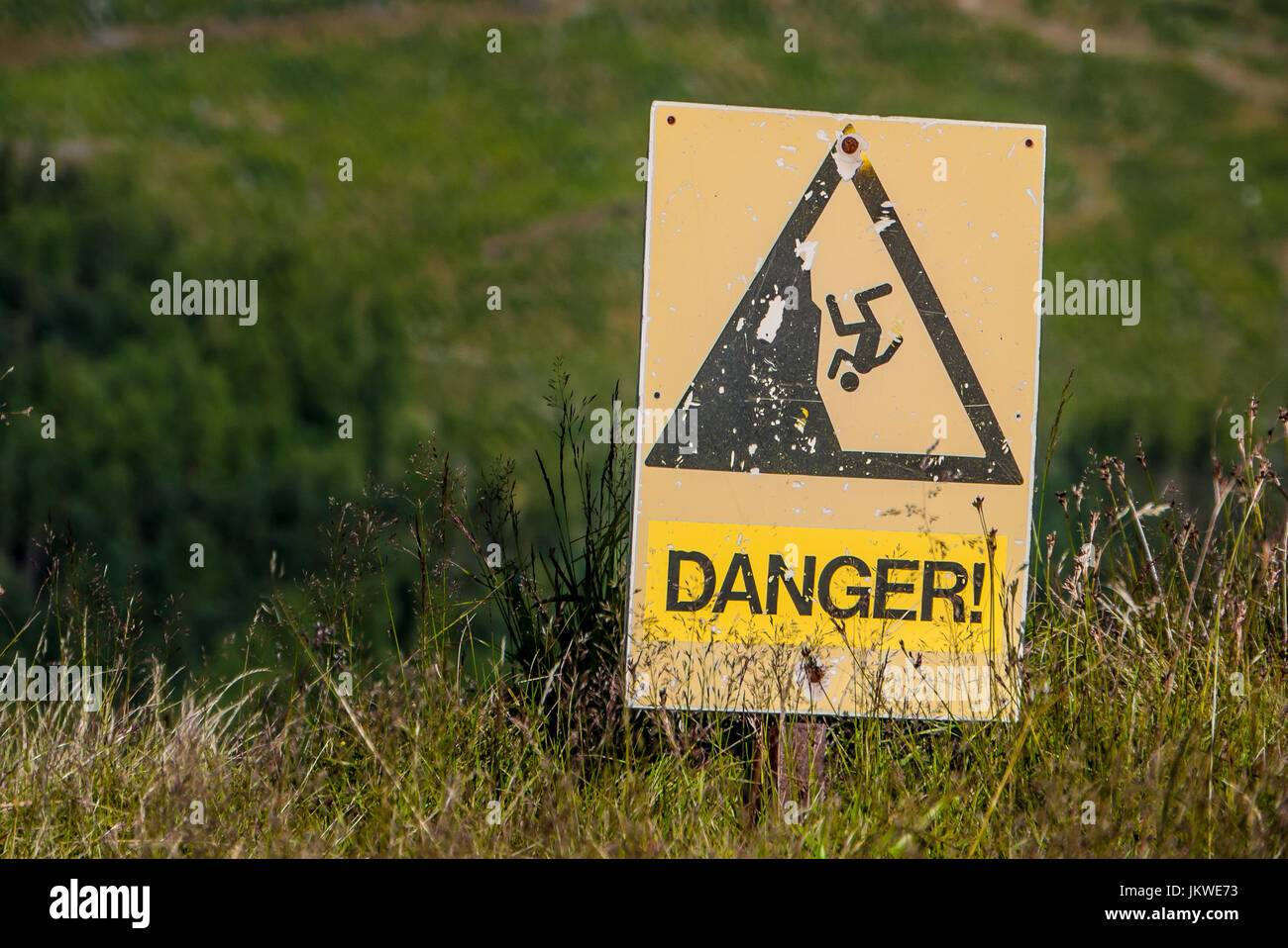 Yellow warning and danger sign in Scotland Stock Photo - Alamy