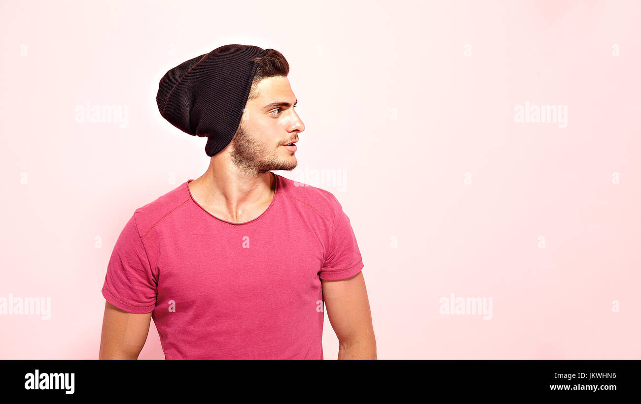 Good-looking guy standing looking away Stock Photo - Alamy