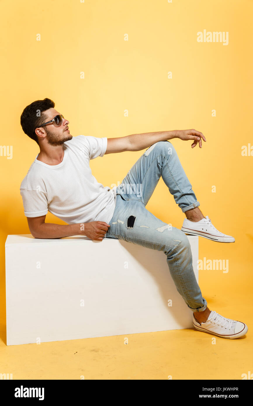 Male model sitting on box hi-res stock photography and images - Alamy