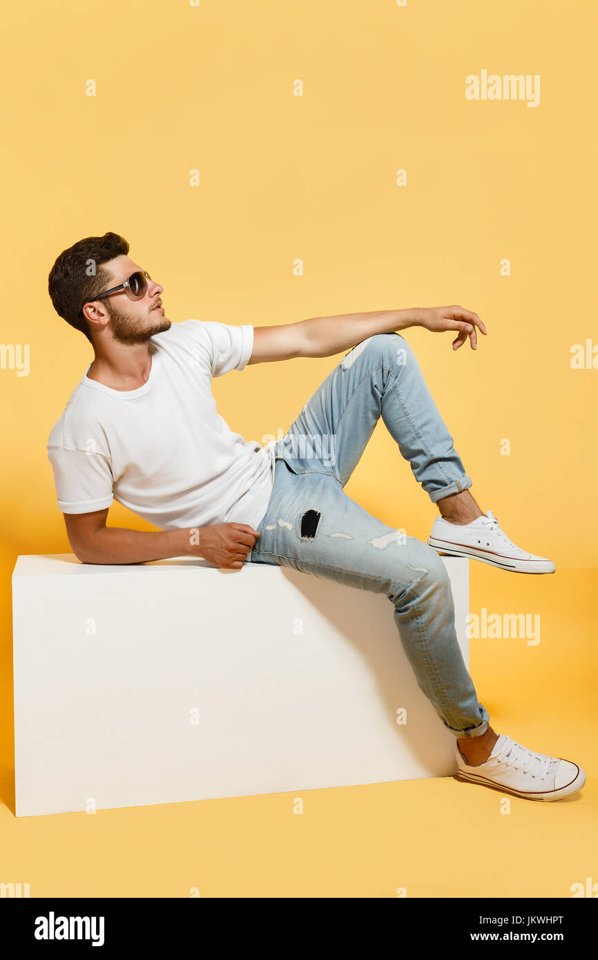 Male model sitting on box hi-res stock photography and images - Alamy