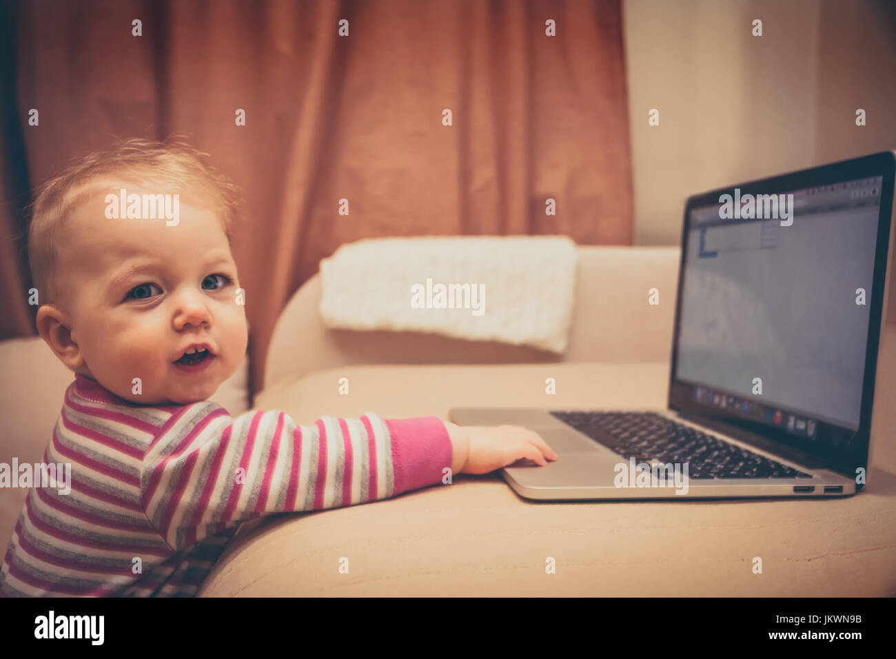 Smart child working on laptop computer indoors Stock Photo - Alamy