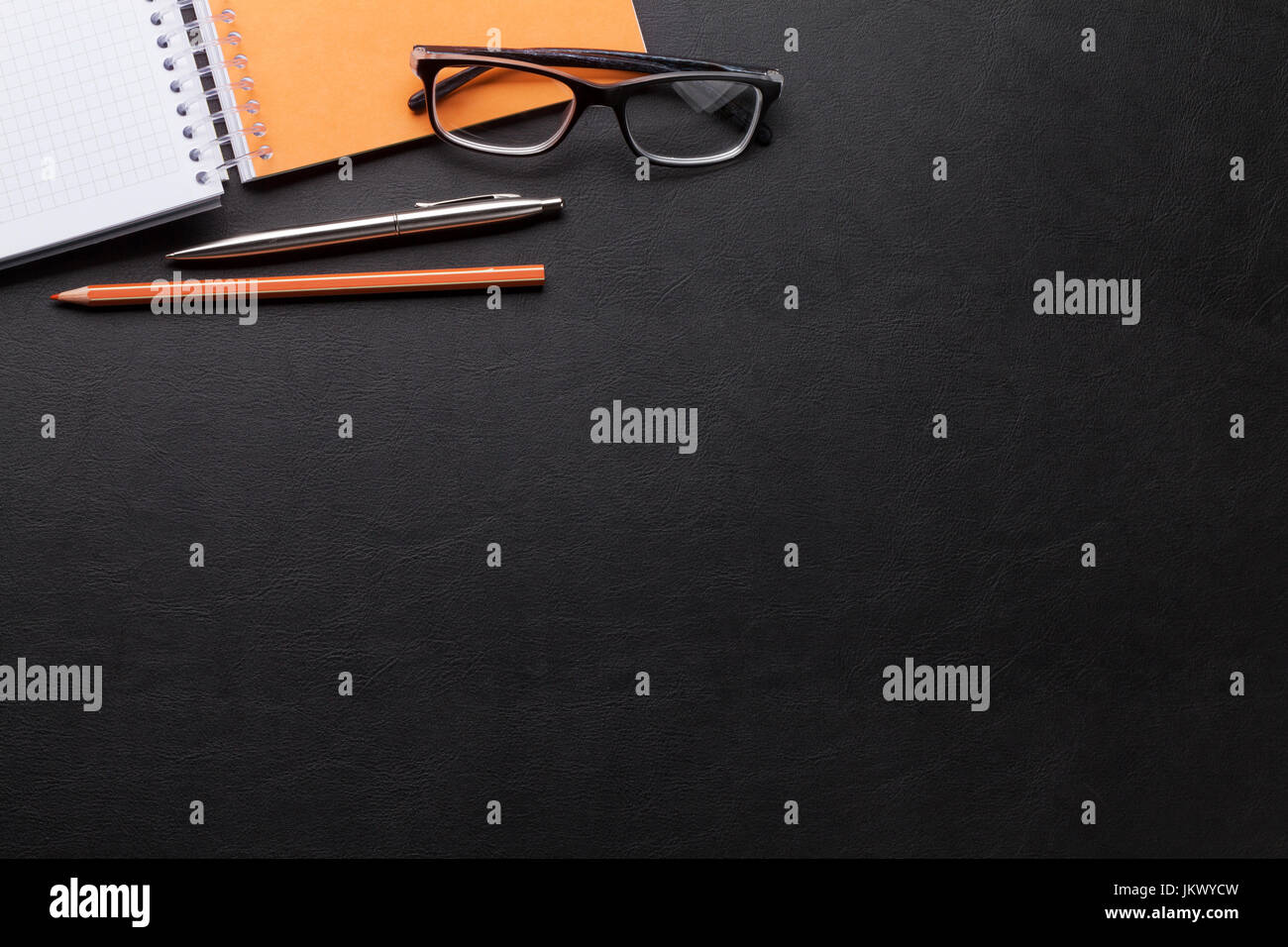 Office desk with notepad and supplies. Top view with space for your ...