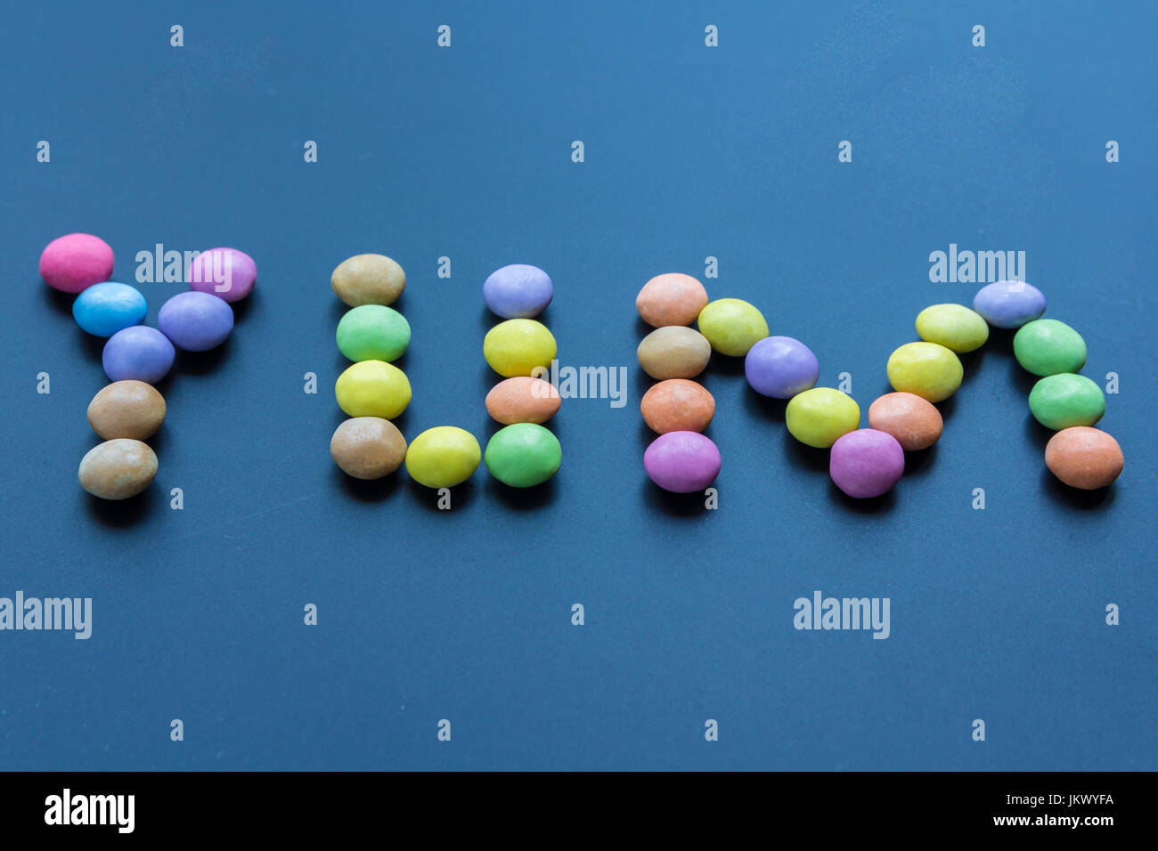 sweet sugary confenctionery in the word yum Stock Photo - Alamy