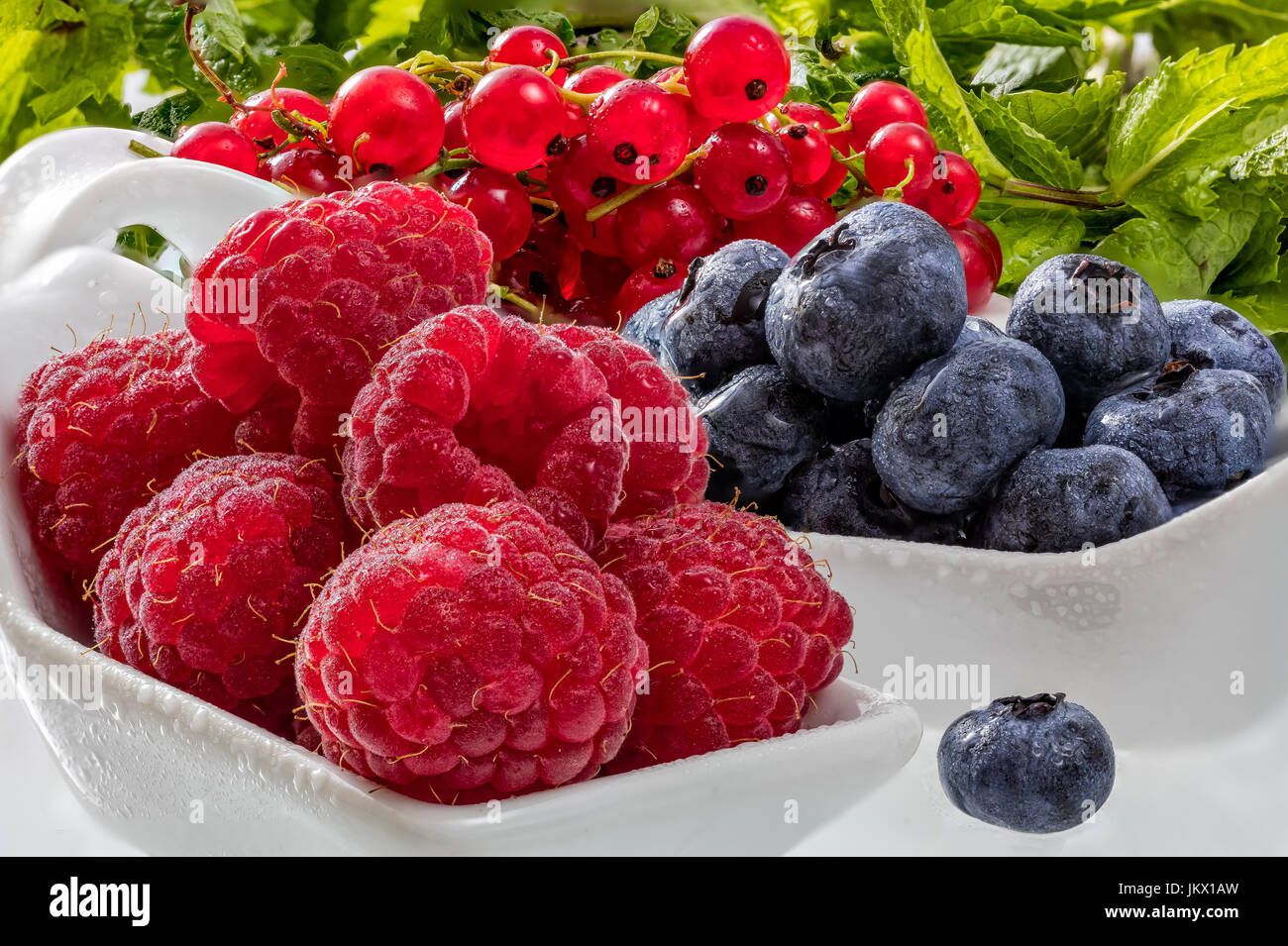groups of mixt fresh berry with mint Stock Photo - Alamy