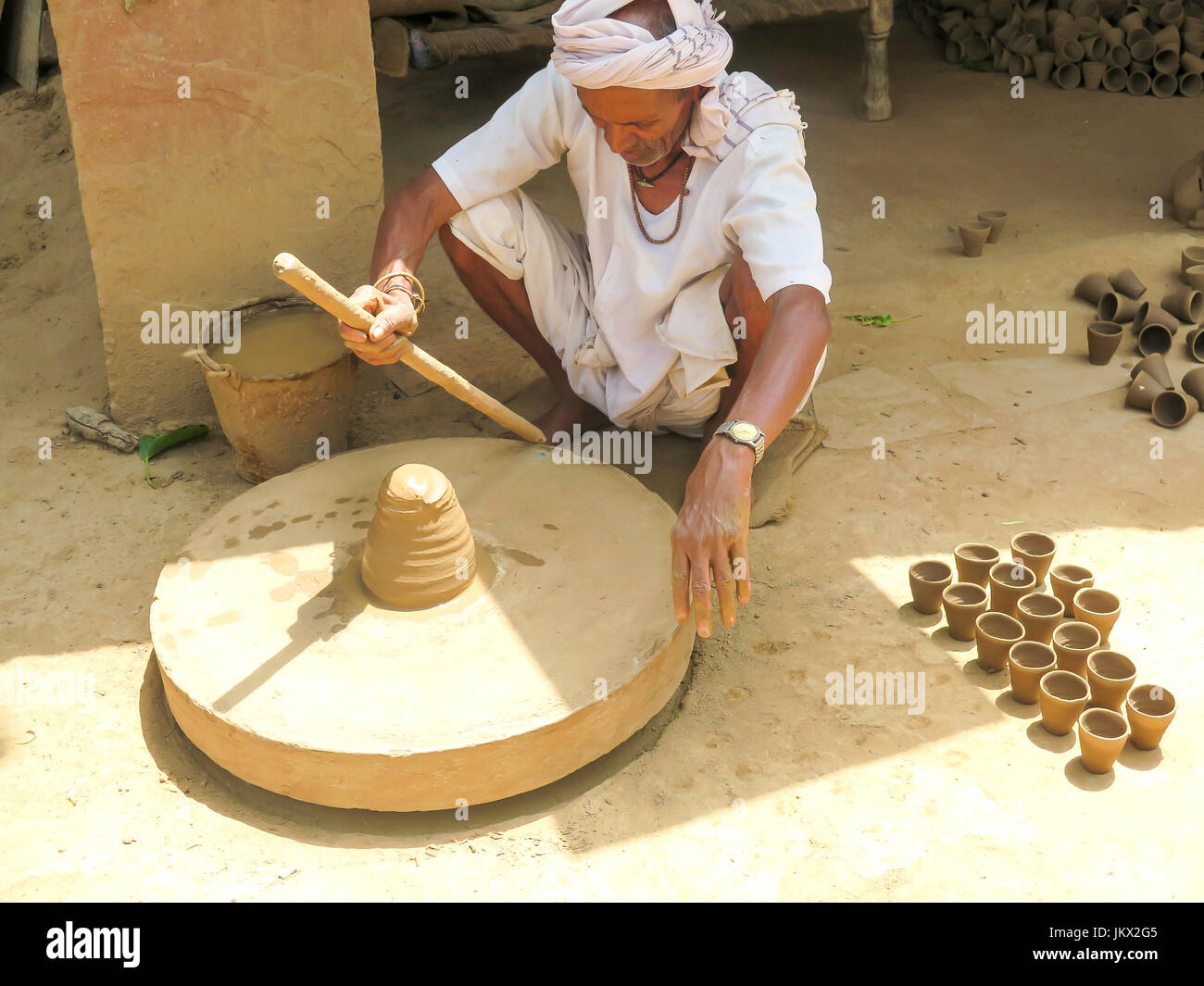 Potter at work and to demonstrate for tourist making clay pots near ...