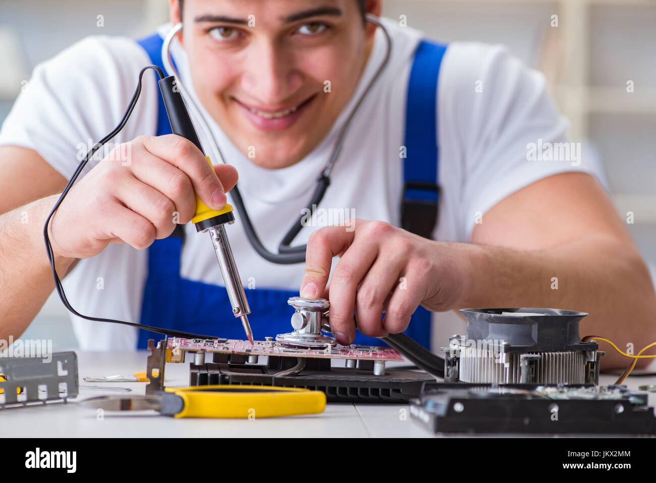 Computer repairman repairing desktop computer Stock Photo - Alamy