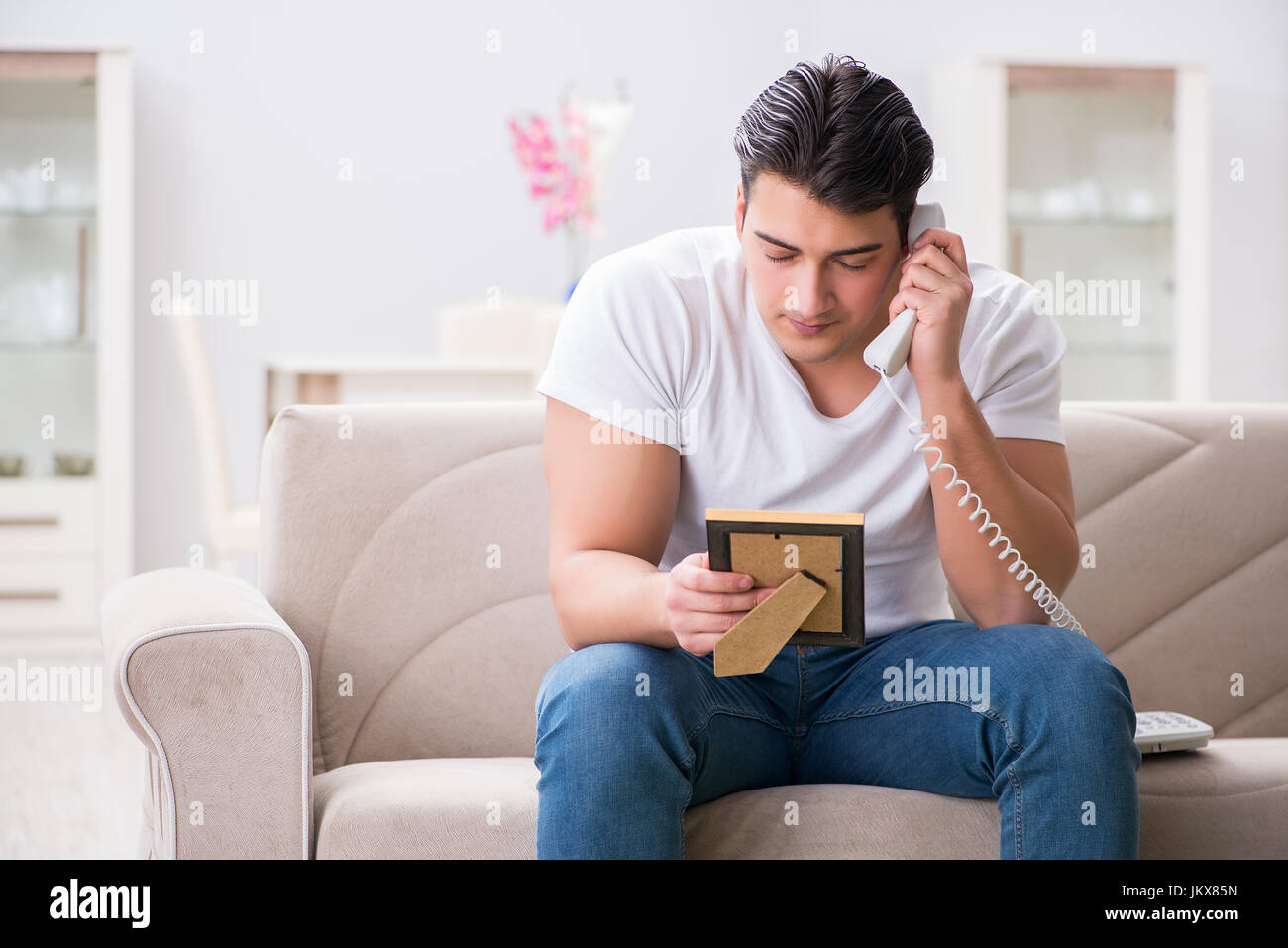Young man in sad saint valentine concept Stock Photo - Alamy